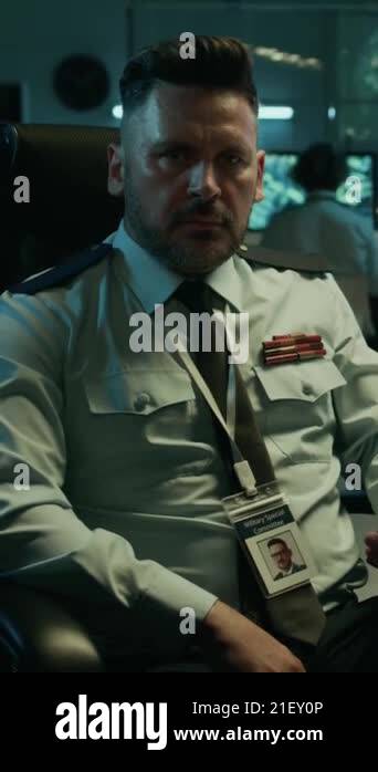 Vertical medium portrait of mature, concerned Caucasian male military ...