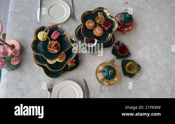 Elegant afternoon tea setup, complete with tiered trays of fresh ...