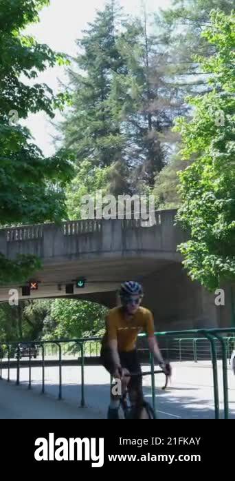 cyclists on the bike lane pass the traffic jam. Canada Vancouver 10.10. ...