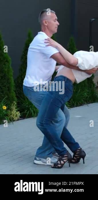 Couple Dancing a Latin Dance Outside the City with Old Town in the ...