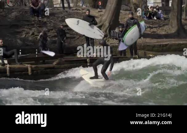 March 28, 2022. Munich, Germany. Eisbachwelle am Englischen Garten ...
