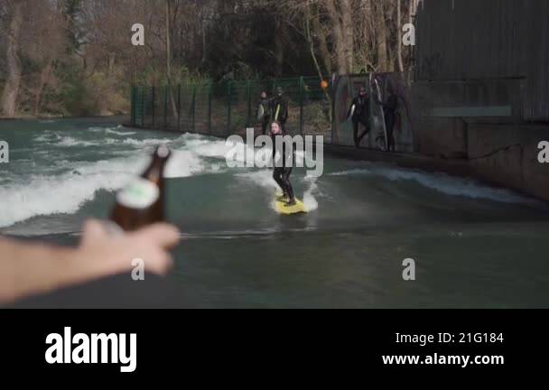 March 25, 2022. Munich, Germany. Surfers surfing an River Isar in ...