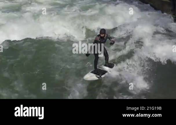 March 28, 2022. Munich, Germany. Eisbachwelle am Englischen Garten ...