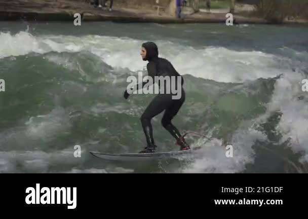 March 28, 2022. Munich, Germany. Eisbachwelle am Englischen Garten ...