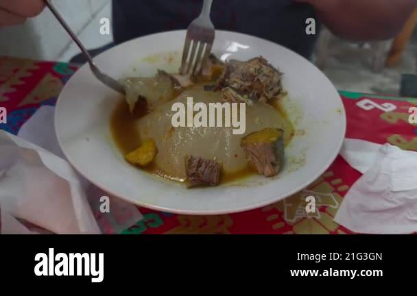 Papeda, a traditional Indonesian sago porridge served with a savory ...