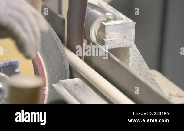 The video shows a woodworking process, where a spinning machine smooths ...