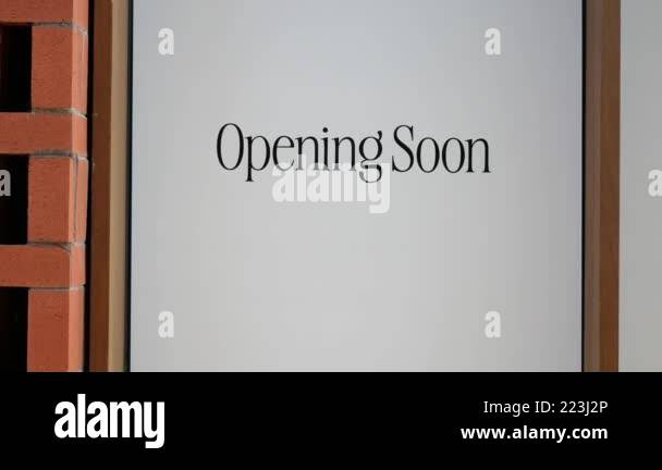 store opening soon sign white door Stock Video Footage - Alamy