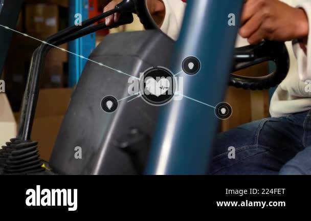 Operating machinery in warehouse, person surrounded by health and ...