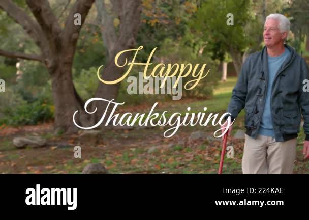 Happy Thanksgiving text animation over elderly man walking in park with ...