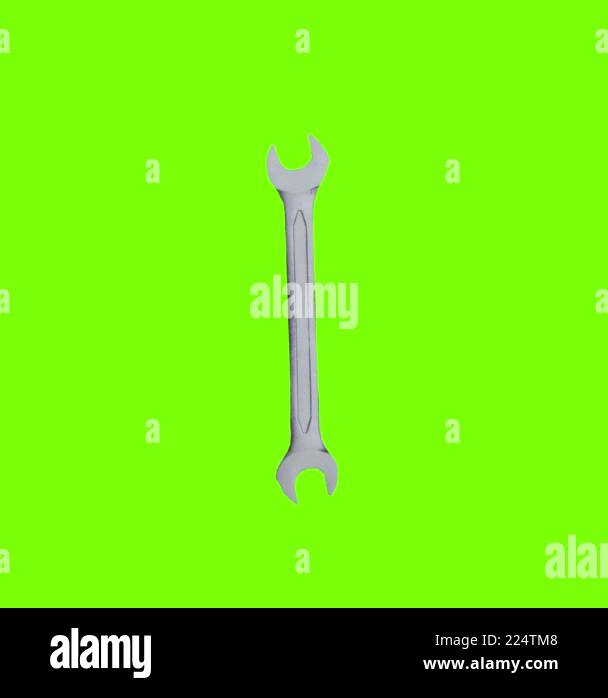 green wrench icon isolated on purple background. spanner tool. tool ...