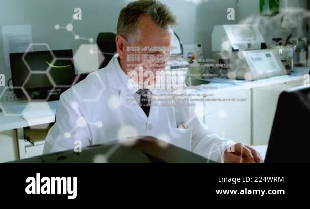 Animation of data processing over caucasian male scientist using laptop ...