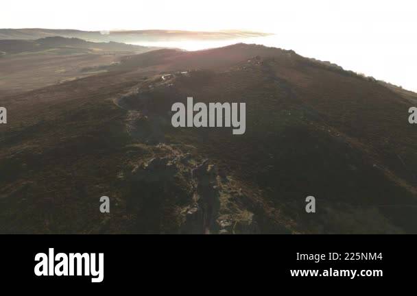 Cinematic aerial boomerang orbit reveal shot of a rugged winter ...