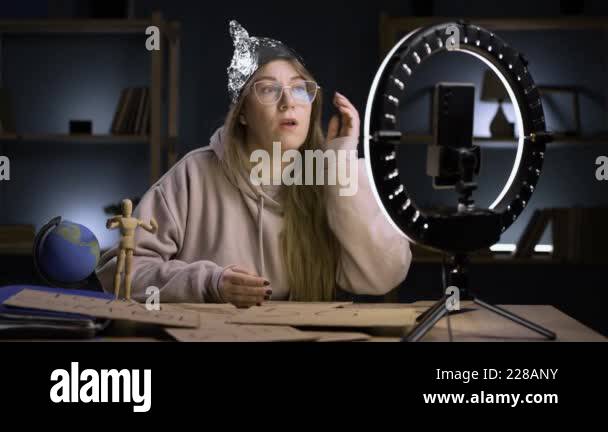 Strange crazy blogger with ring light and smartphone, paranoid woman ...