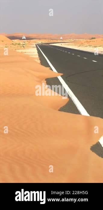 Desert road covered by shifting sand creates striking scenes of nature ...