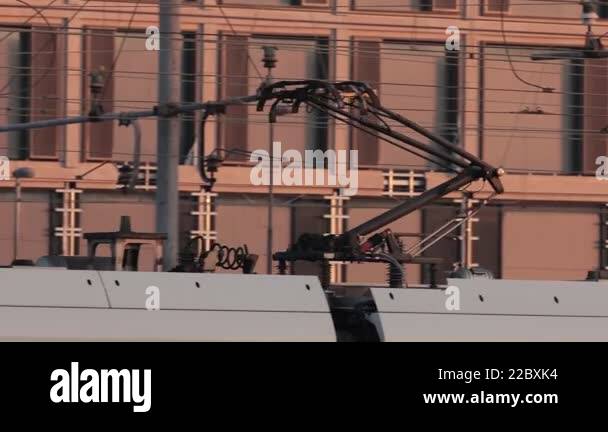 Pantograph on a train with sparks flying away from graphite slider due ...