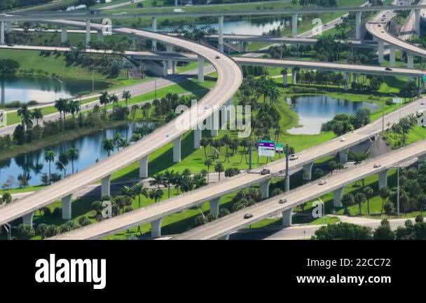 Complex highway overpass elevated direction lanes with busy traffic in ...