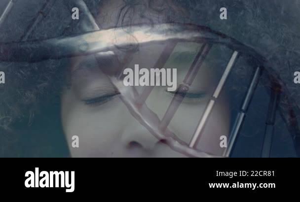 Animating DNA strand over close-up of person face, showing genetic ...