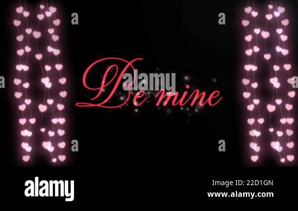 Be mine text animation over hanging pink heart lights on black ...
