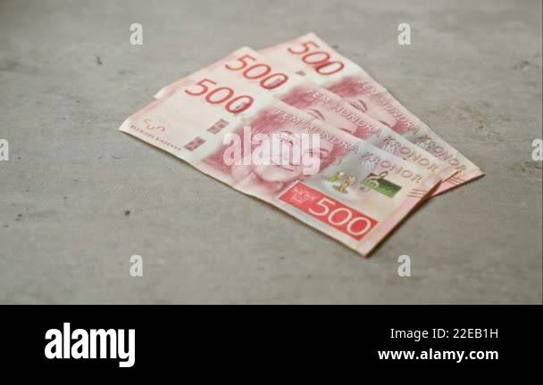 Swedish banknotes on a concrete surface with 500 krona denominations ...