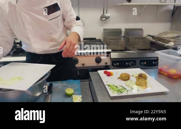 Plating Of A Raw And Cooked Fish Based Appetizer In A Luxury Italian ...