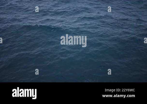 Rippling ocean waves forming a textured seascape outdoors, with rich ...