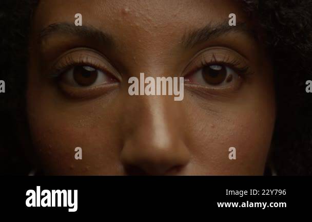 Extreme close-up of a womans eyes showing an intense and focused gaze ...