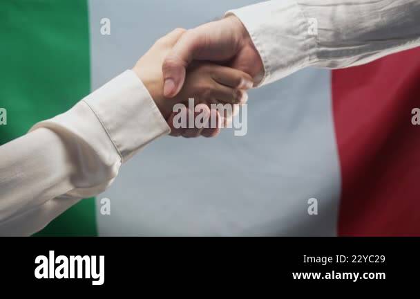 Italian Man And Woman Business Partners Shaking Hands.handshake,Make ...