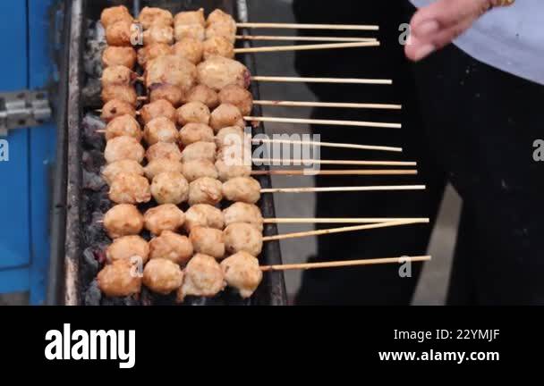 Pentol Bakar, Seller grilling the meatball. Grilled meatball or pentol ...