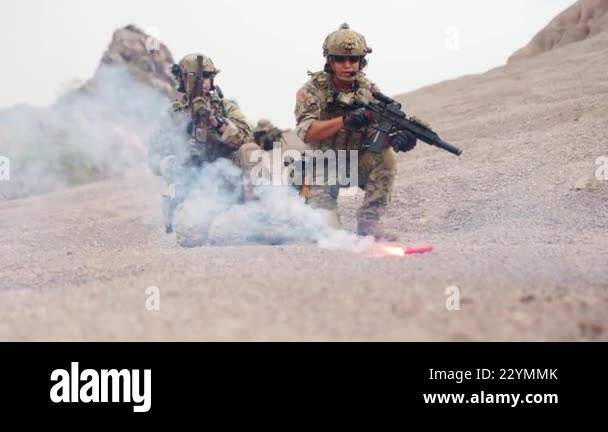 Special forces unit soldiers giving flare signals ready perform their ...