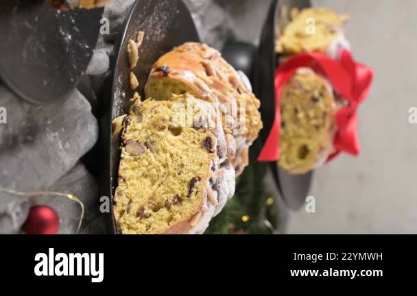 A slice of Bolo Rainha, a traditional Portuguese sweet bread, dusted ...