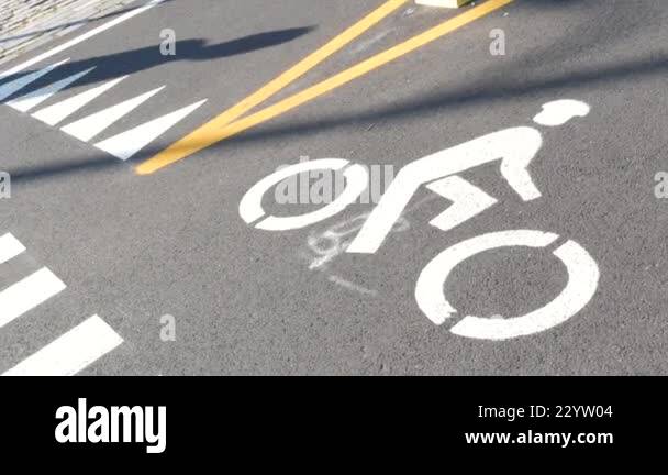 Bike lane asphalt sign, New York City. Bicycle path, cycle route for ...