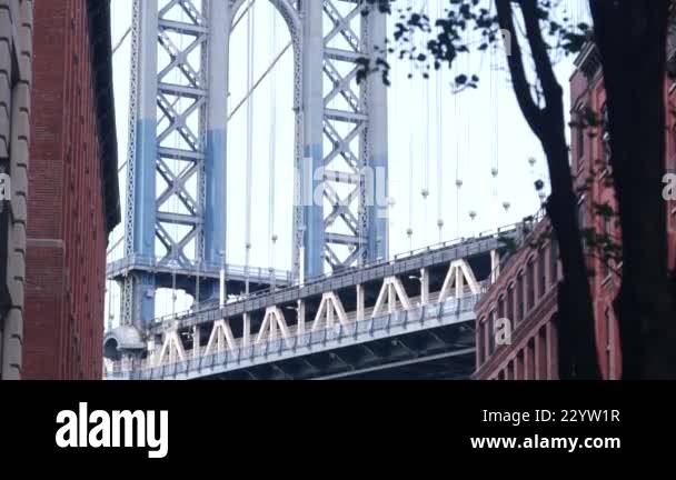 New York City Manhattan Bridge in Dumbo, Brooklyn. Red brick building on Washington street near ...