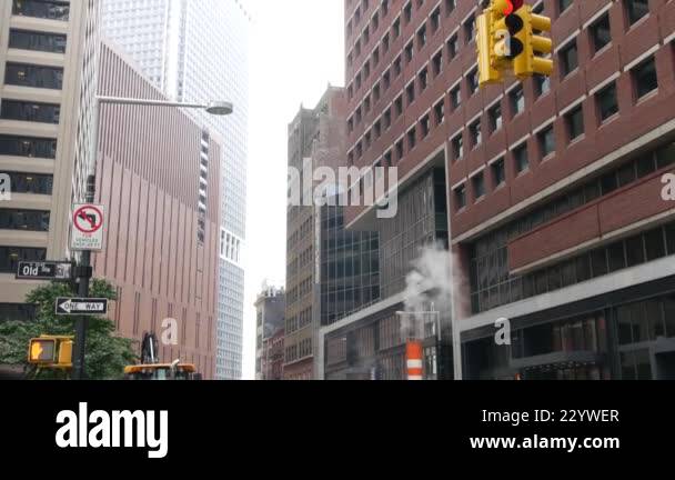Steam vapor vented on New York City Water street, orange vapour tube ...