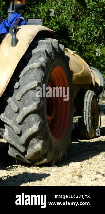 Move Tractor, orange big garden tractor, agricultural equipment working ...