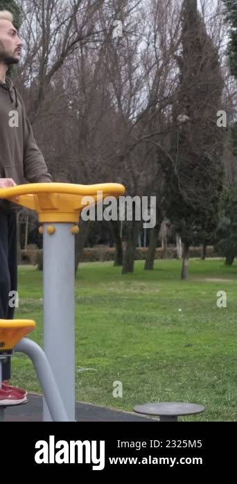 Turning waist stretching movement, doing sports on public sports ...