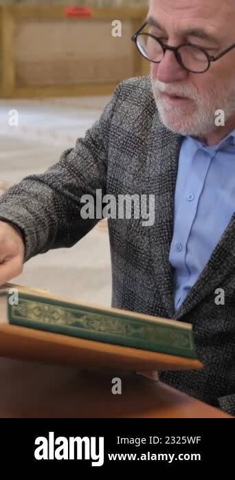 Little boy taking Quran lessons in the mosque, learning to read from ...