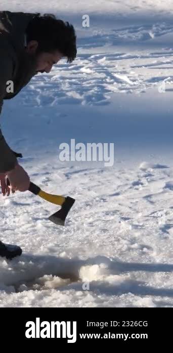 Concept image of young man breaking the top layer of ice to reach the ...