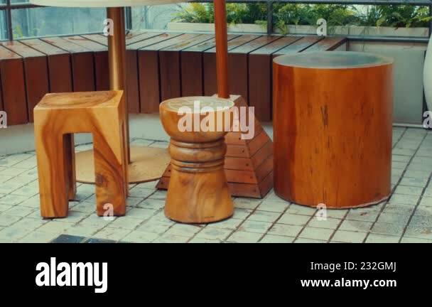 A collection of wooden furniture pieces including a square stool, a ...