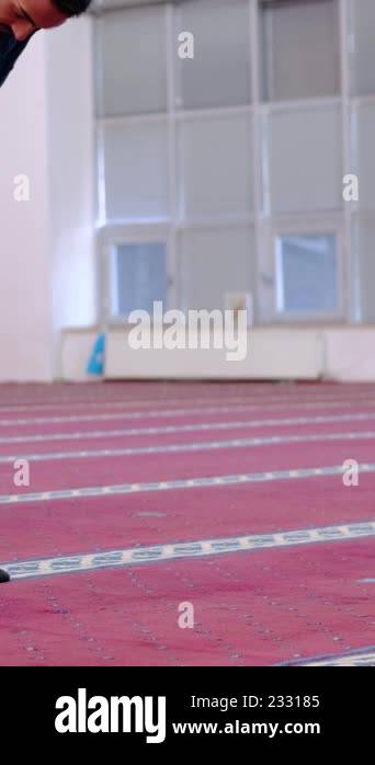 Muslim man praying with his forehead on the ground, young man who ...