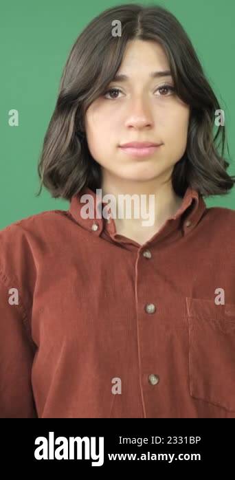 Image of young woman making a check mark with her hand, facial ...