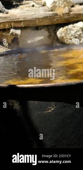 Traditional wheat cooking, Wheats boiling in a cauldron, rice pulses ...