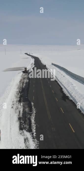 Snow-covered highway taken from the air, road closed to traffic in ...