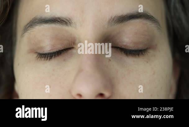 Closeup of bright sad green eyes of a woman. Tired dull female gaze ...