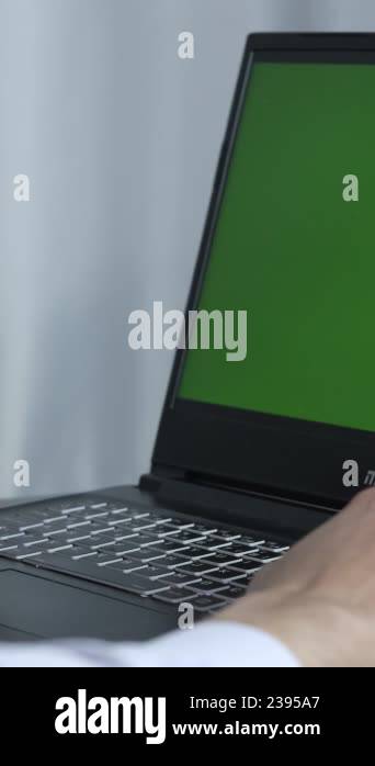 casual wearing man working on greenscreen monitor, the employee who ...