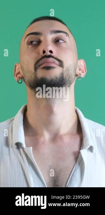 Young mans huffing and puffing facial expression, models solitary ...