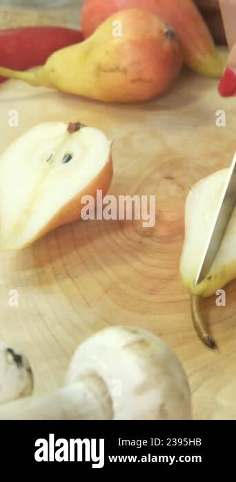 Image of cutting pears with a knife on a serving plate, cutting fruit ...