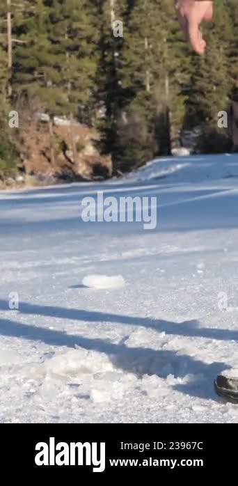 Break ice ax, concept image of young man breaking the top layer of ice ...