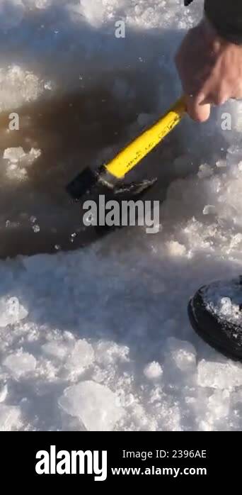 Ice Exploration, concept image of young man breaking the top layer of ...