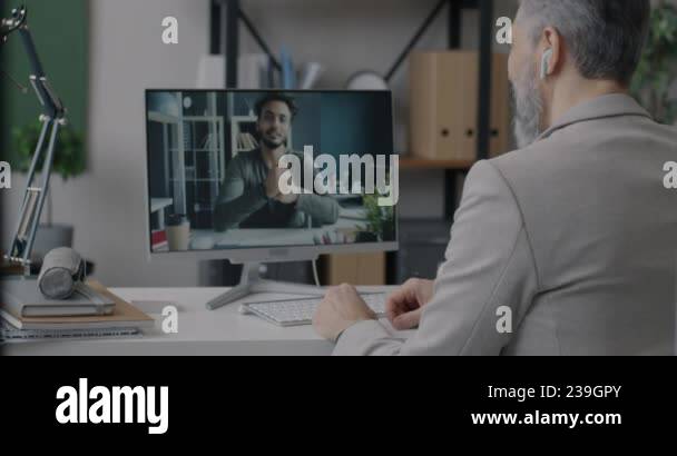 Businesspeople colleagues making online video call talking waving hand ...