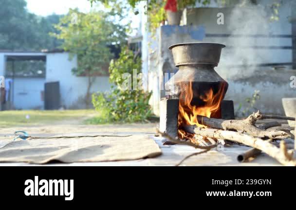Traditional clay stove with wood fuel, Rural kitchen. Traditional ...